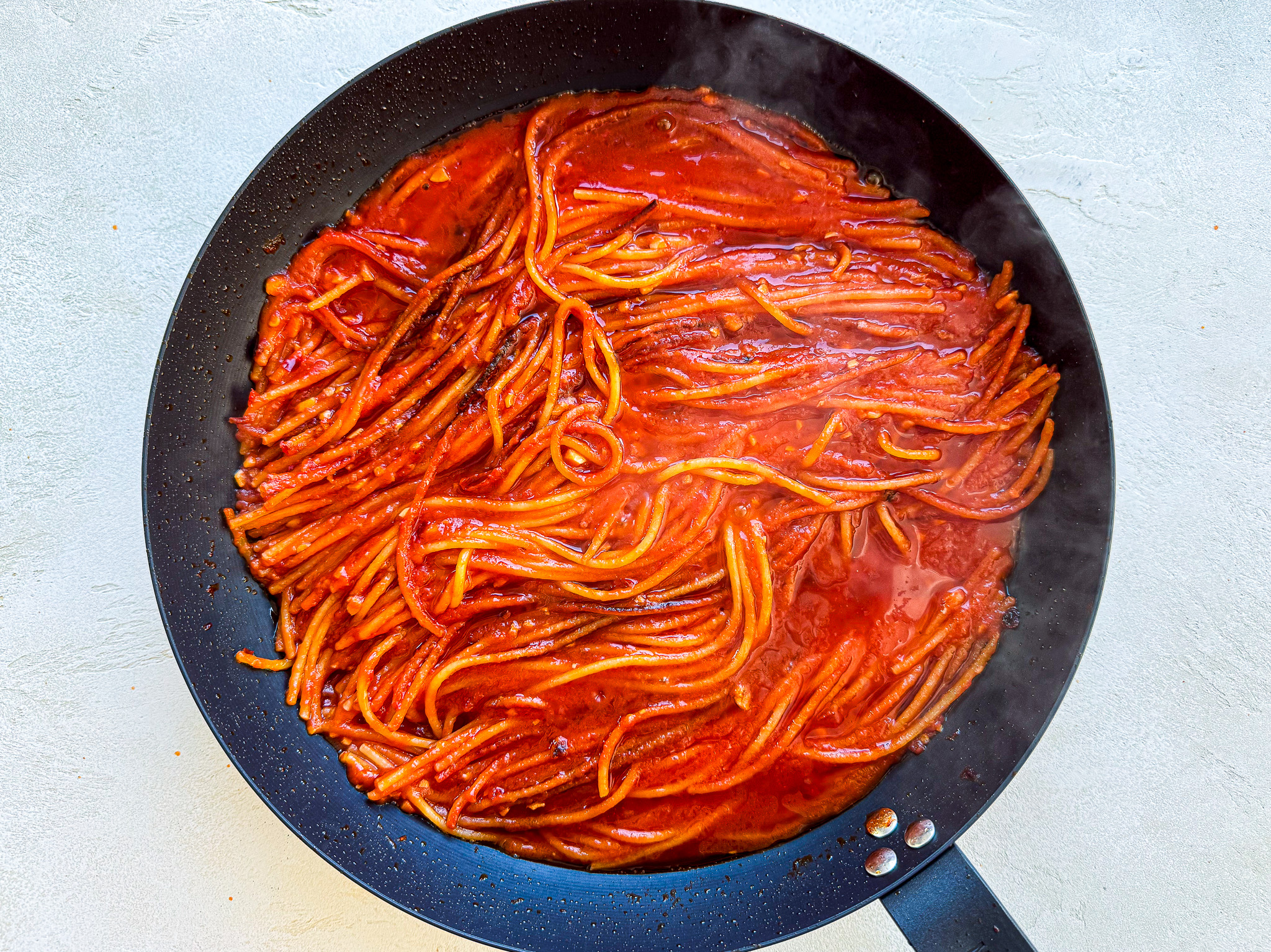 puglia's spicy, seared tomato spaghetti